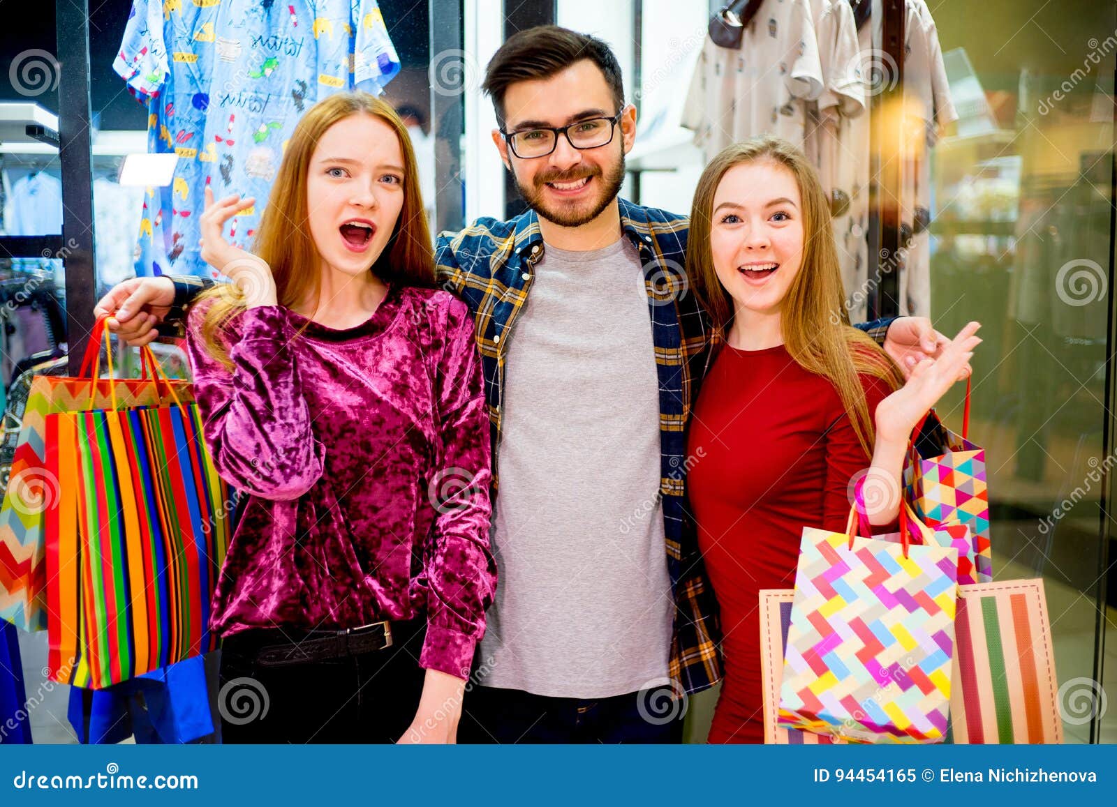 Friends shopping in mall stock image. Image of looking - 94454165