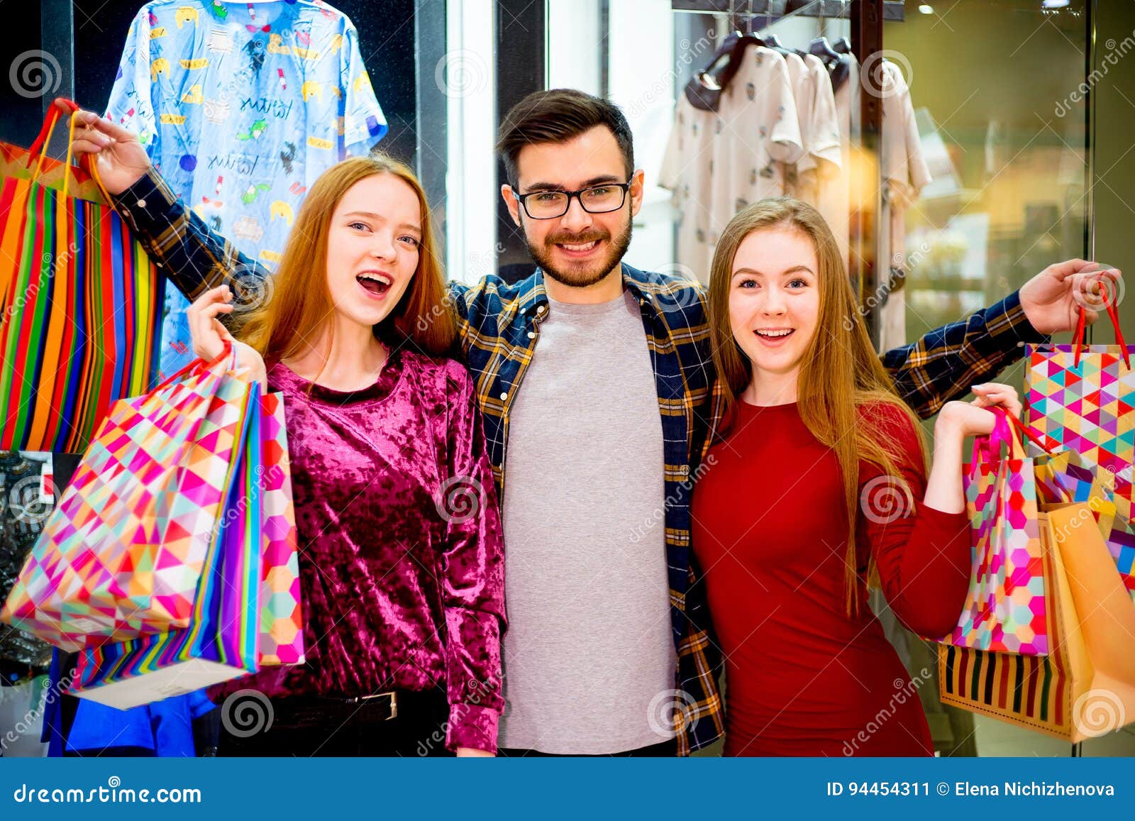 Friends shopping in mall stock image. Image of buying - 94454311