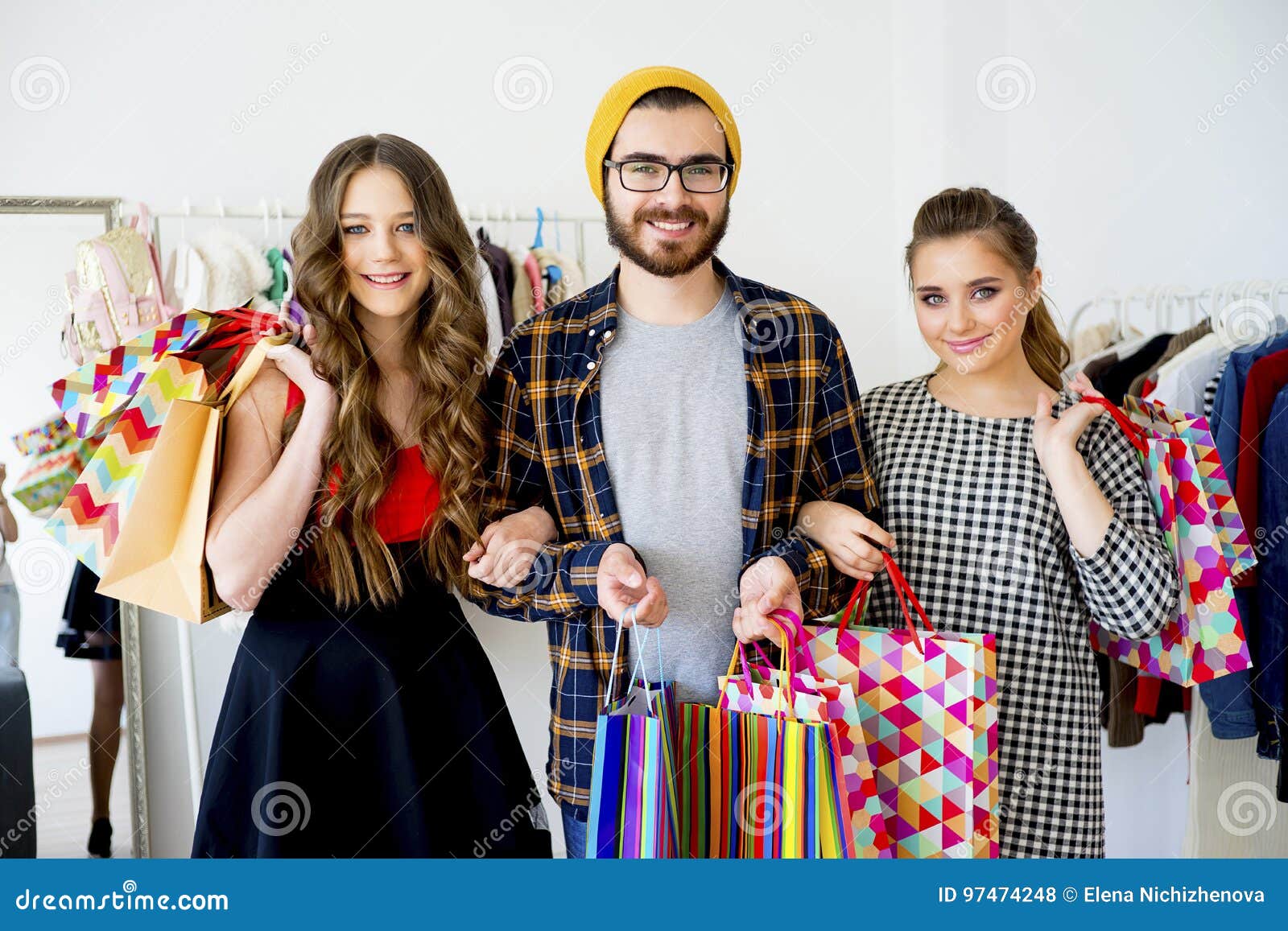 Friends shopping together stock photo. Image of shopping - 97474248