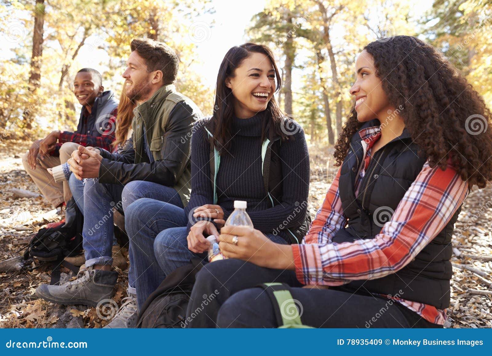 Friends Sit on a Fallen Tree in Forest, Two Women Talking Stock Image ...