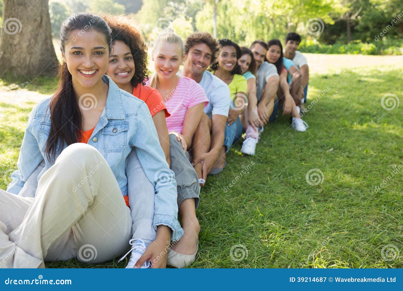 Friends Sitting in Line on Campus Stock Image - Image of smiling ...