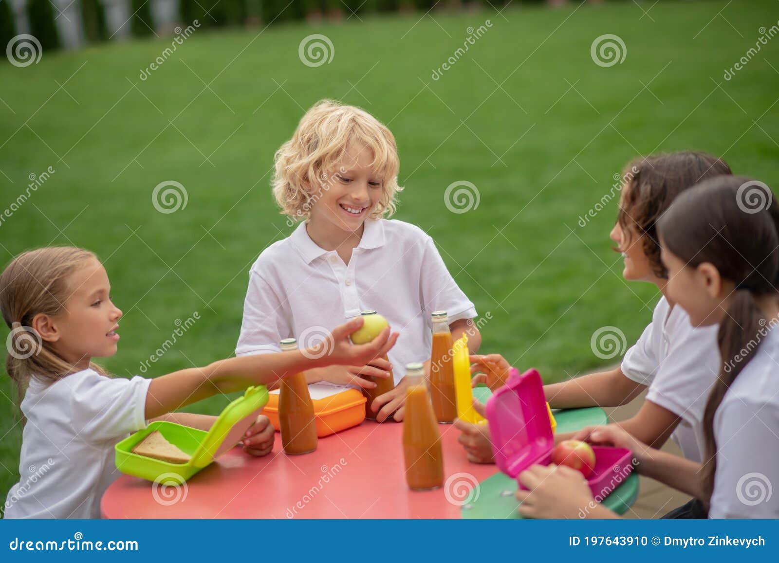 Friends Sitting at the Table and Having Lunch Stock Photo - Image of ...