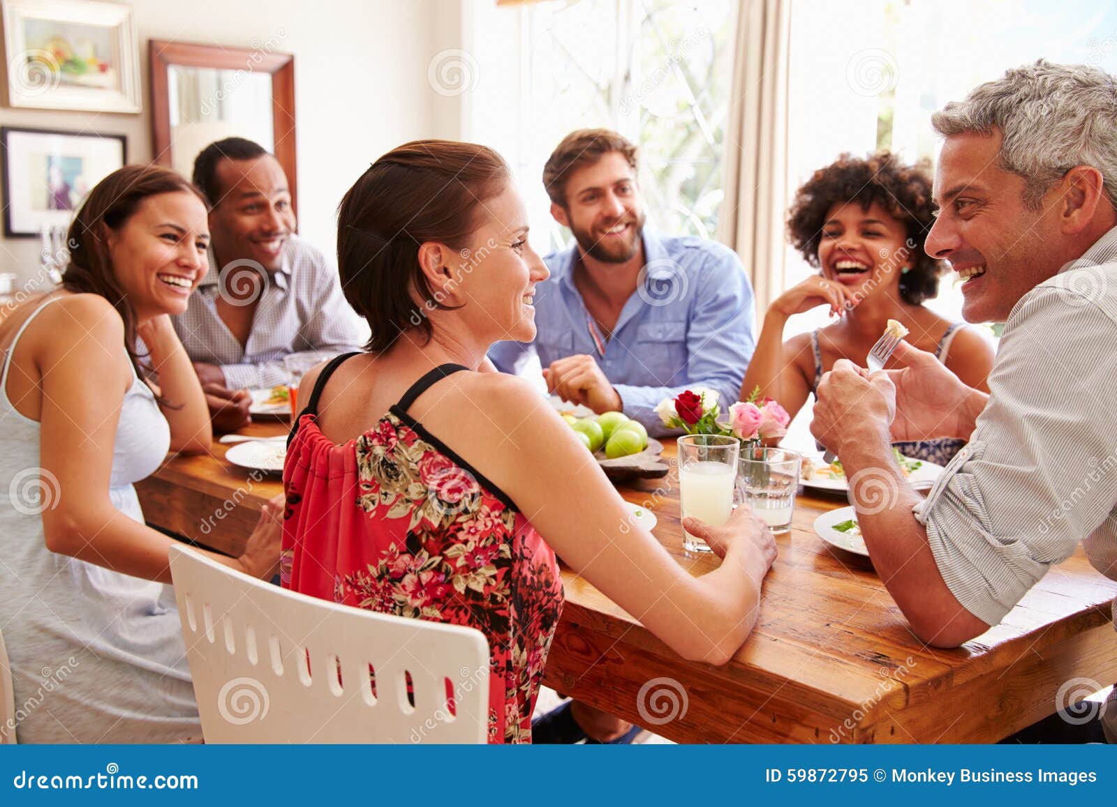 Friends Sitting at a Table Talking during a Dinner Party Stock Image ...