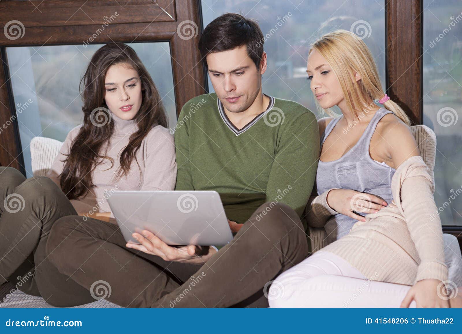 Friends Sitting Together on the Sofa Stock Photo - Image of friends ...