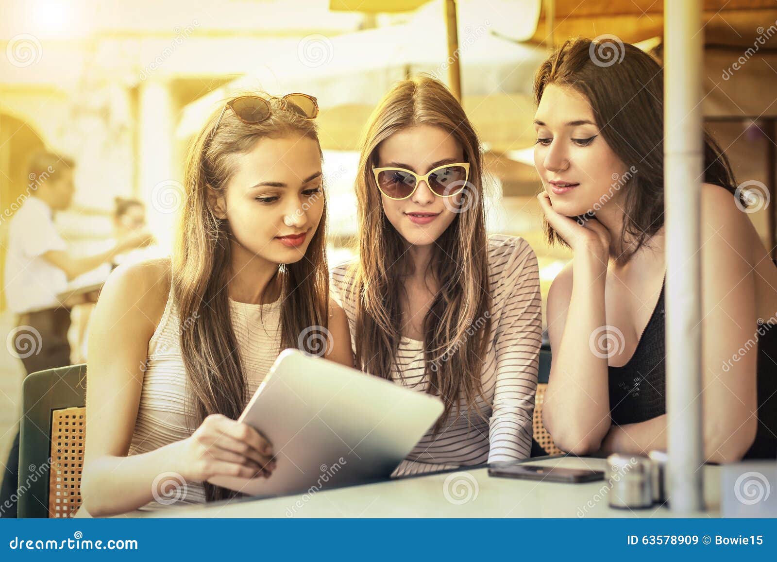Friends sitting together stock image. Image of city, group - 63578909