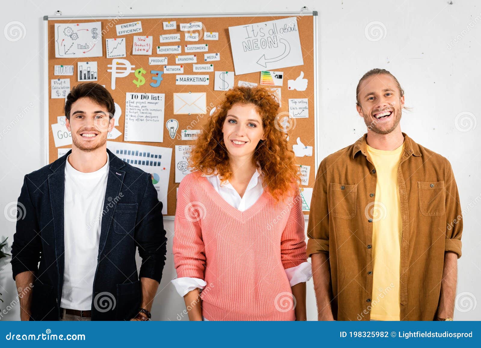 Friends Smiling and Looking at Camera in Office Stock Photo - Image of ...