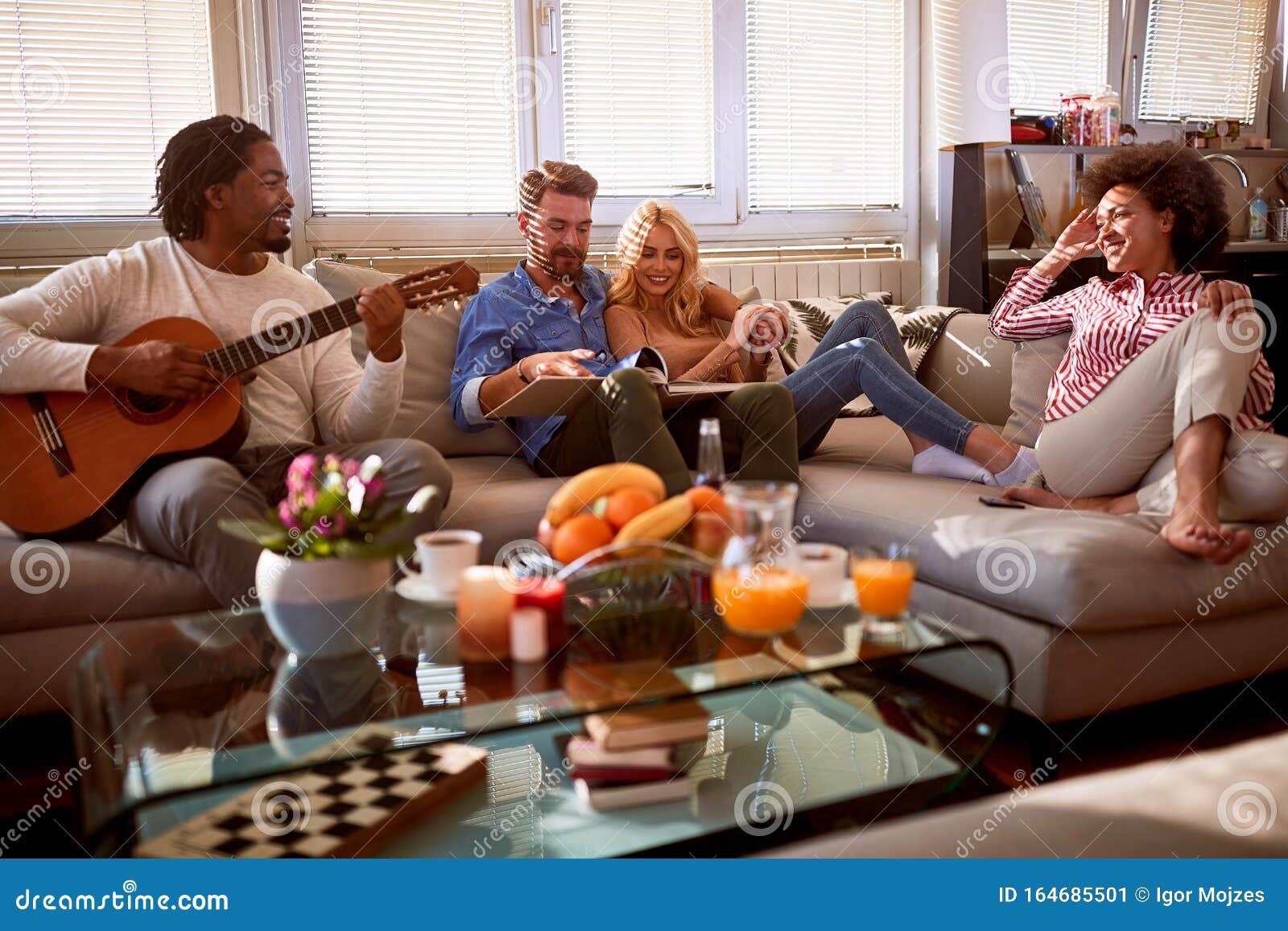 Friends Socializing in Apartment Stock Image - Image of lifestyle ...