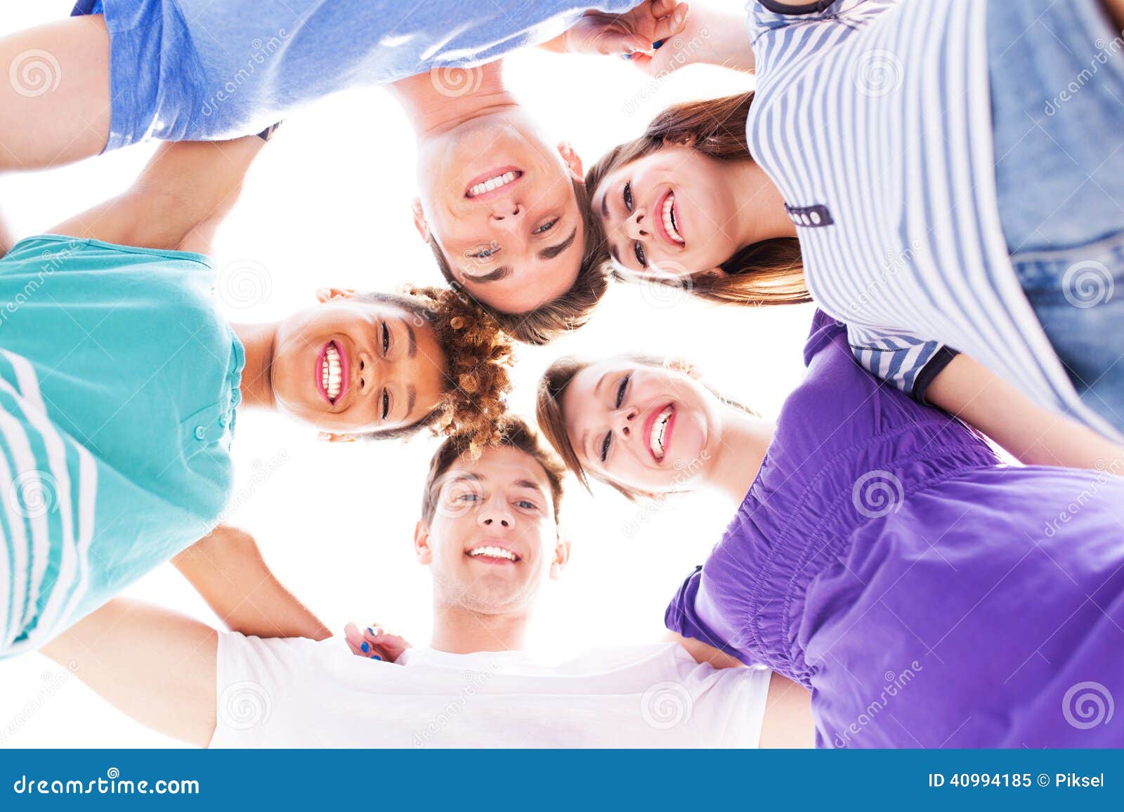 Friends standing in huddle stock image. Image of cheerful - 40994185