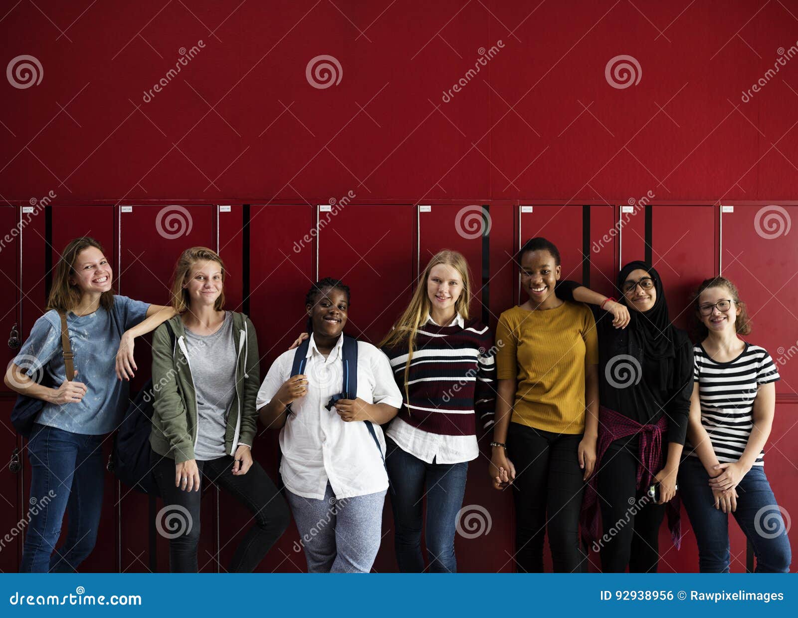 Friends Standing Together in Front of Lockers Stock Photo - Image of ...