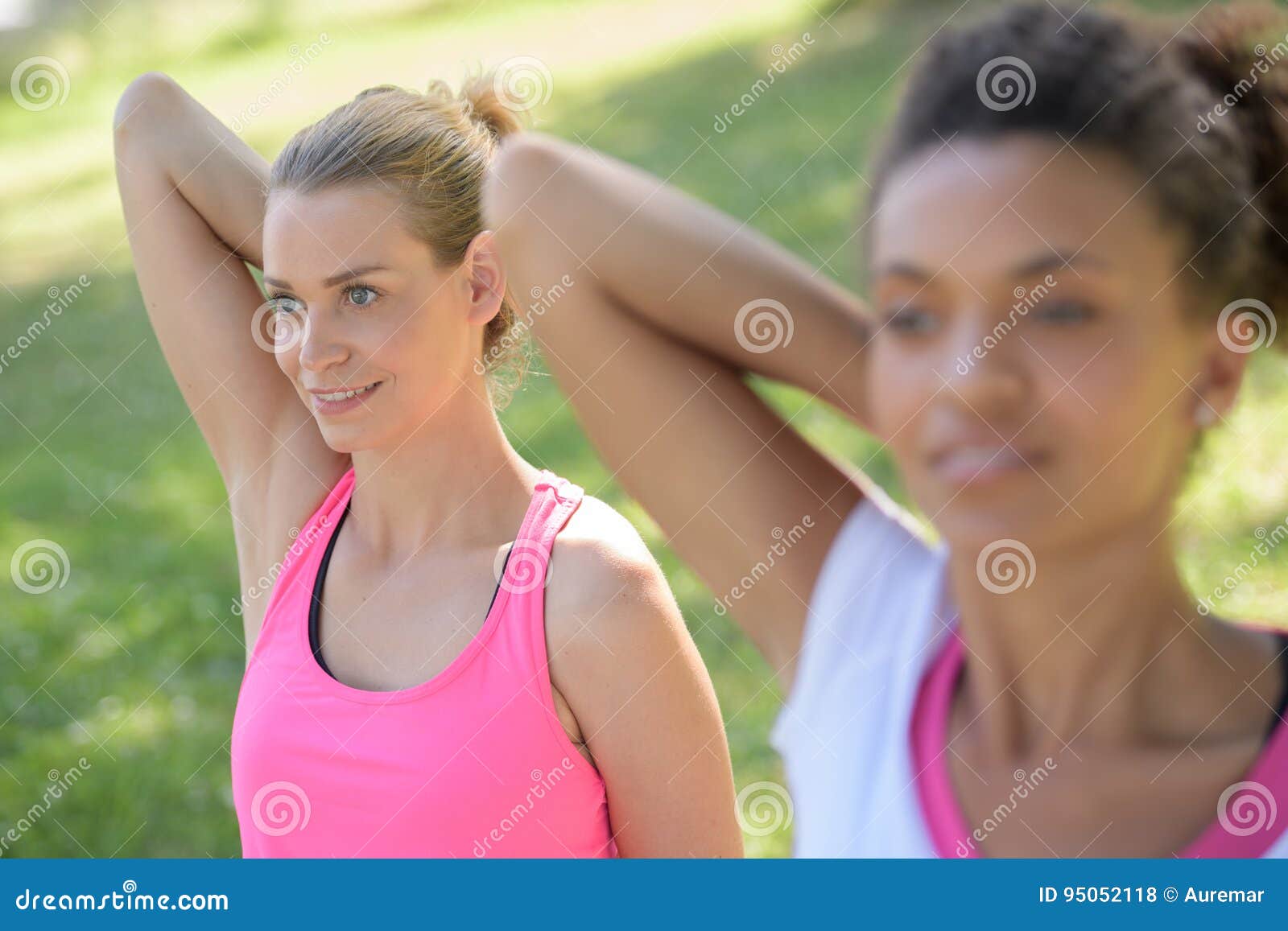 Friends Stretching Together in Park Stock Photo - Image of stretching ...