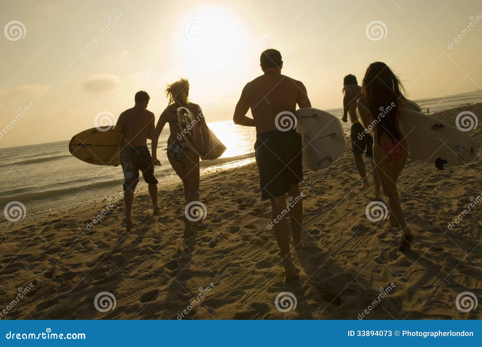 Friends with Surfboards Running Towards Ocean Stock Image - Image of ...