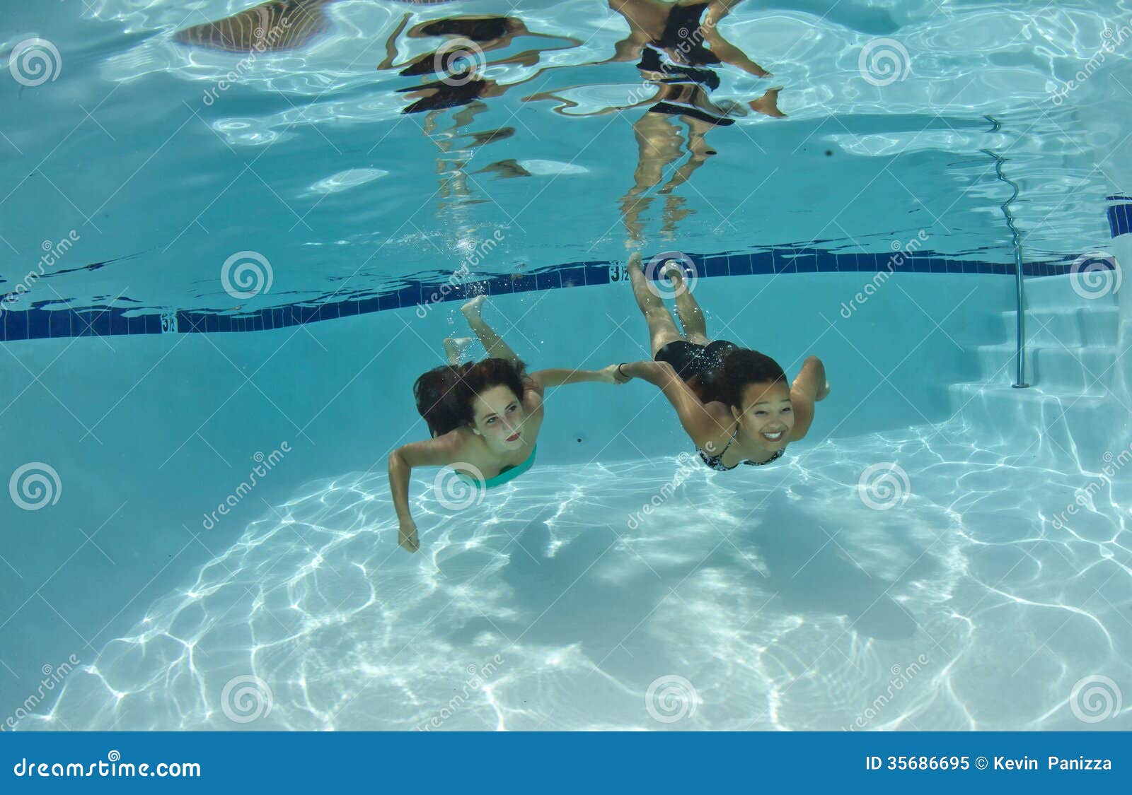 Friends Swimming Underwater Stock Image - Image of sports, young: 35686695