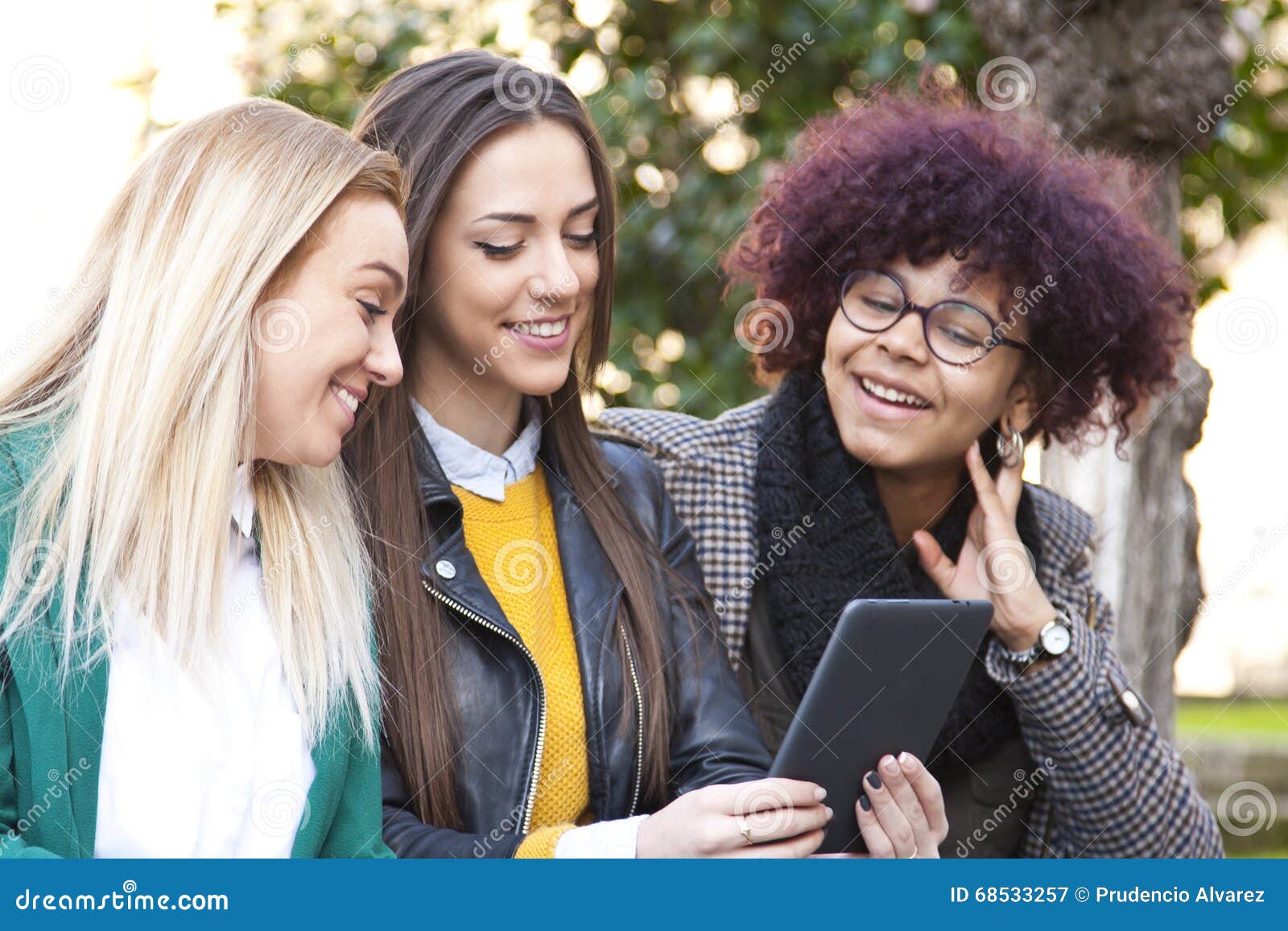 Friends with the tablet stock image. Image of concept - 68533257