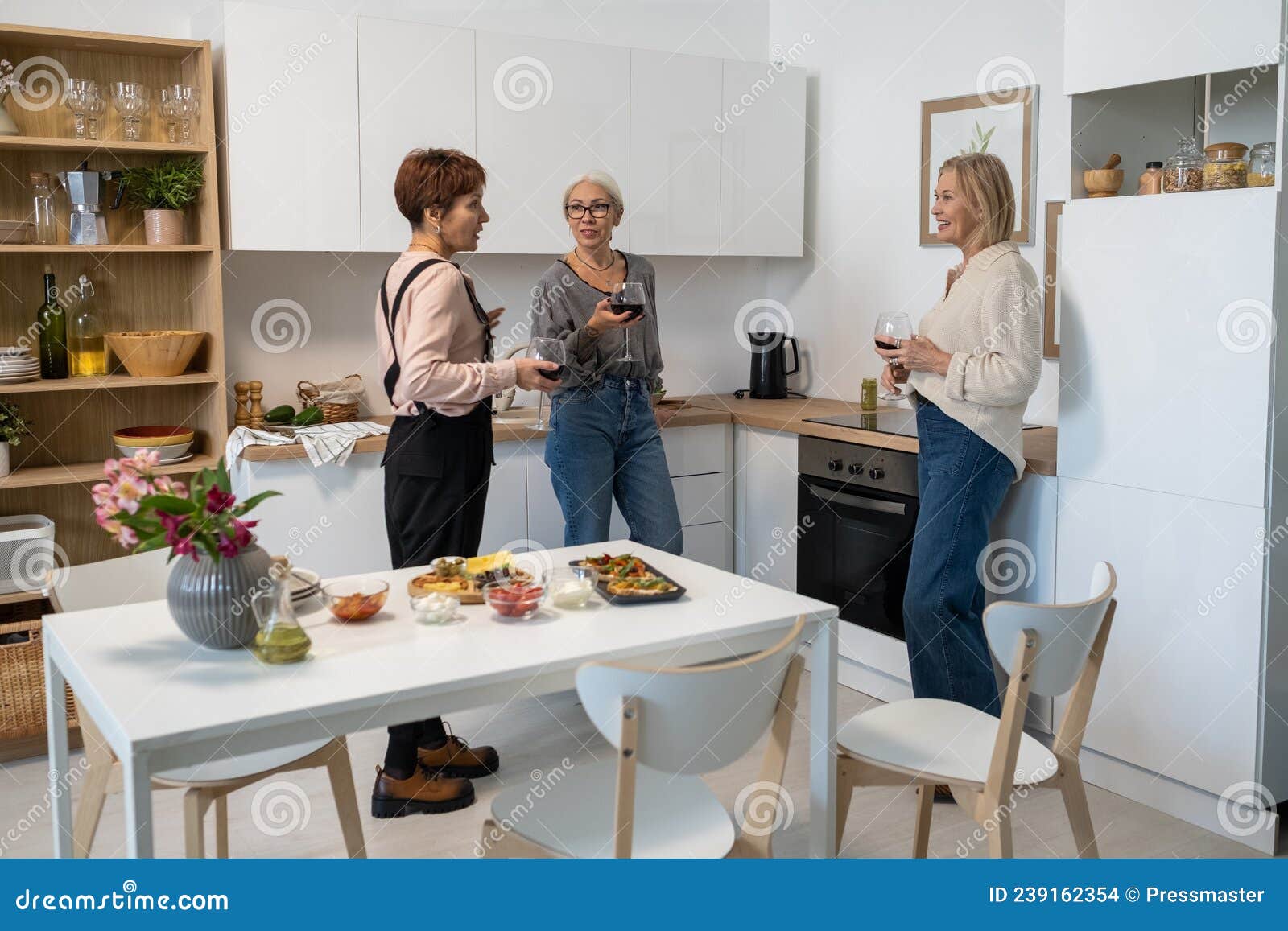 Friends Talking during Meeting in the Kitchen Stock Photo - Image of ...