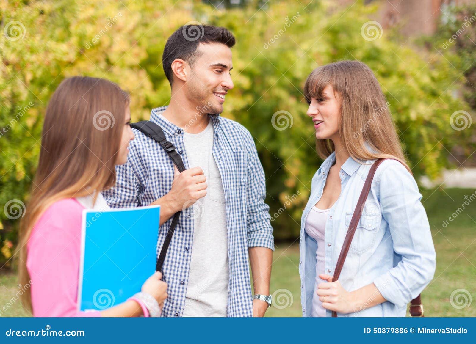 Friends talking in a park stock photo. Image of speaking - 50879886
