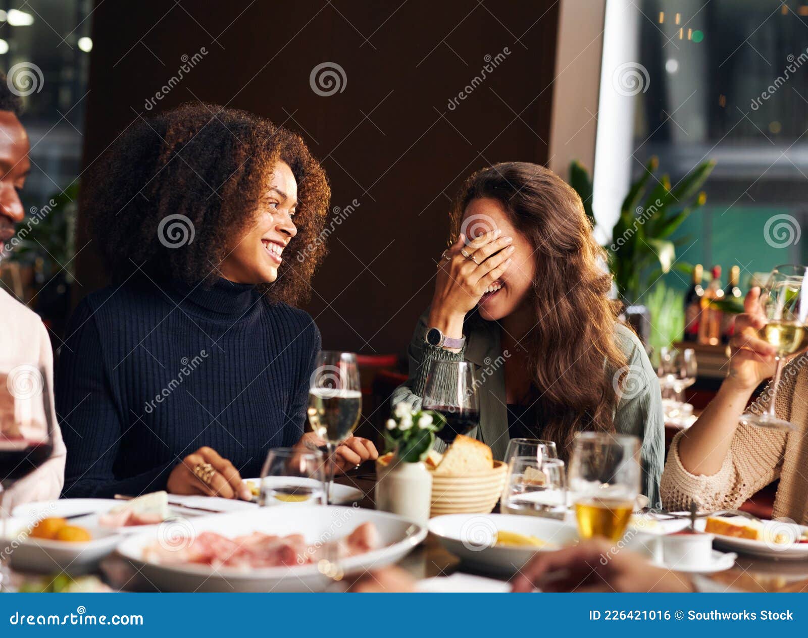 Friends Telling Jokes at Dinner in Restaurant Stock Photo - Image of ...
