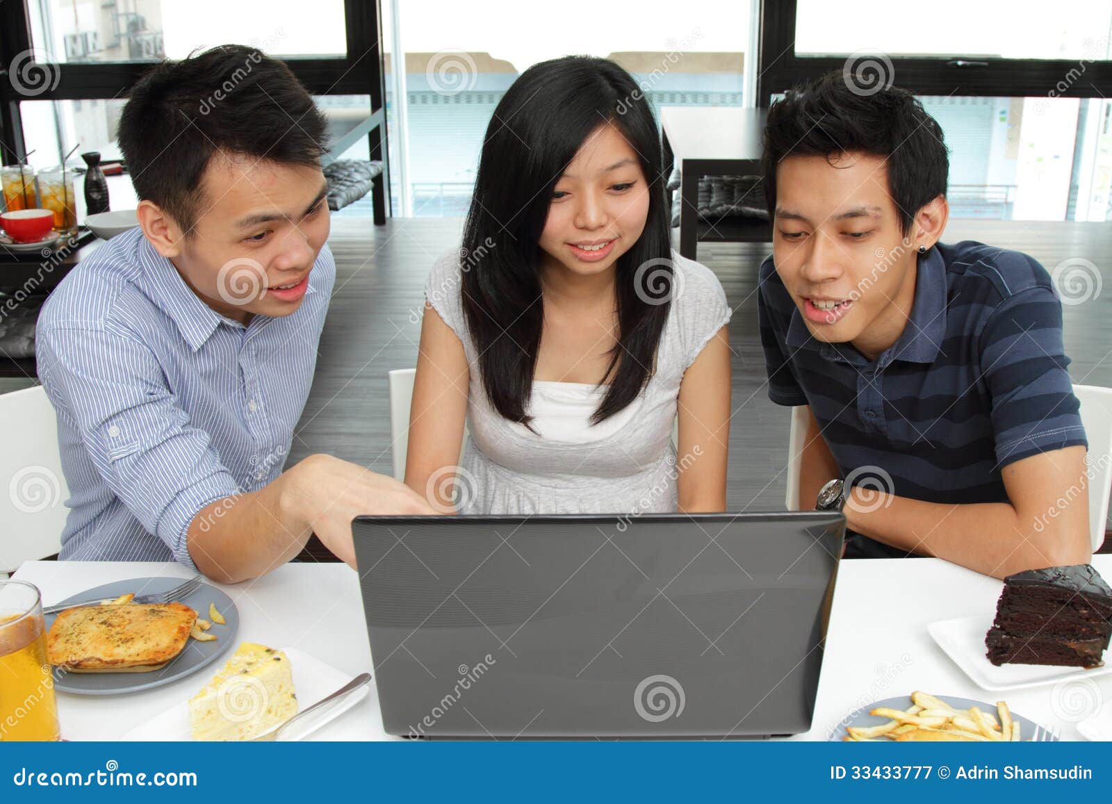 Friends using a laptop stock image. Image of networking - 33433777