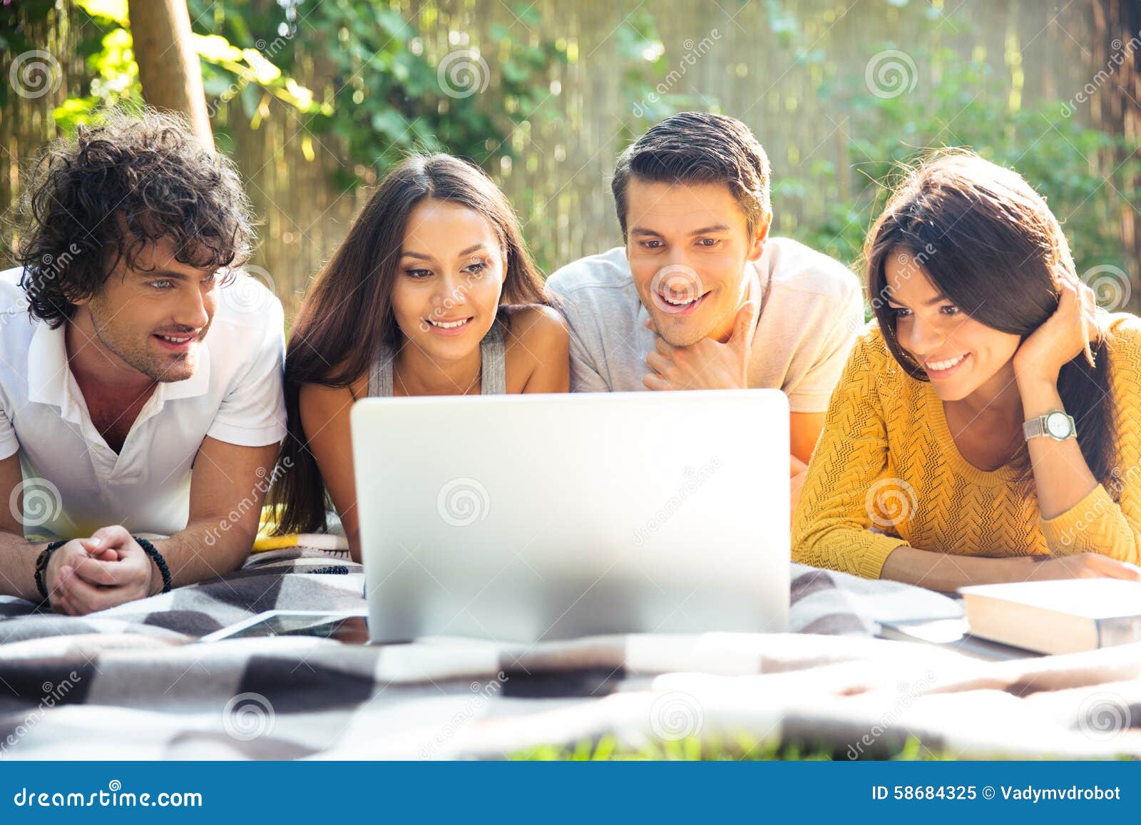 Friends Using Laptop Outdoors Stock Image - Image of grass, merriment ...