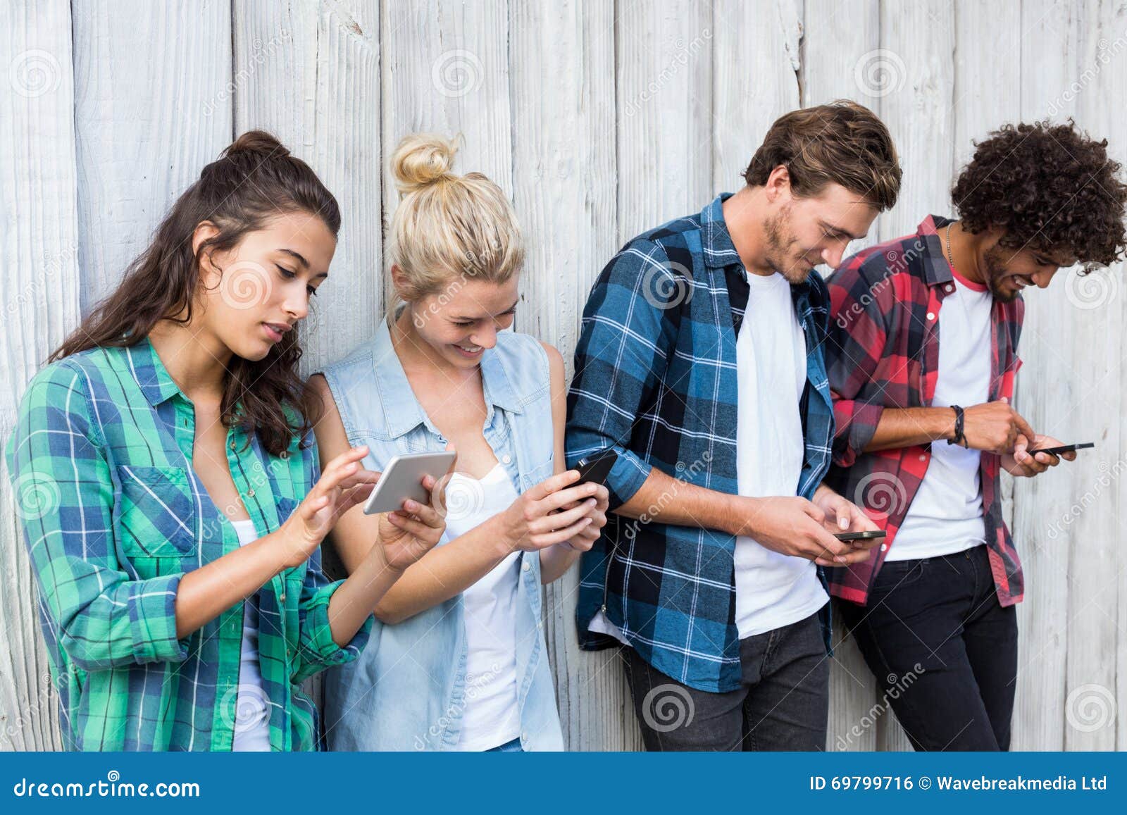 Friends using mobile phone stock photo. Image of lifestyle - 69799716