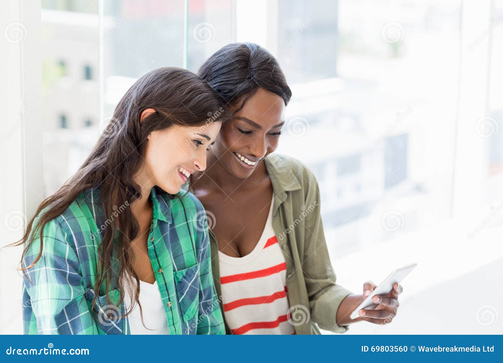 Friends using mobile phone stock photo. Image of break - 69803560