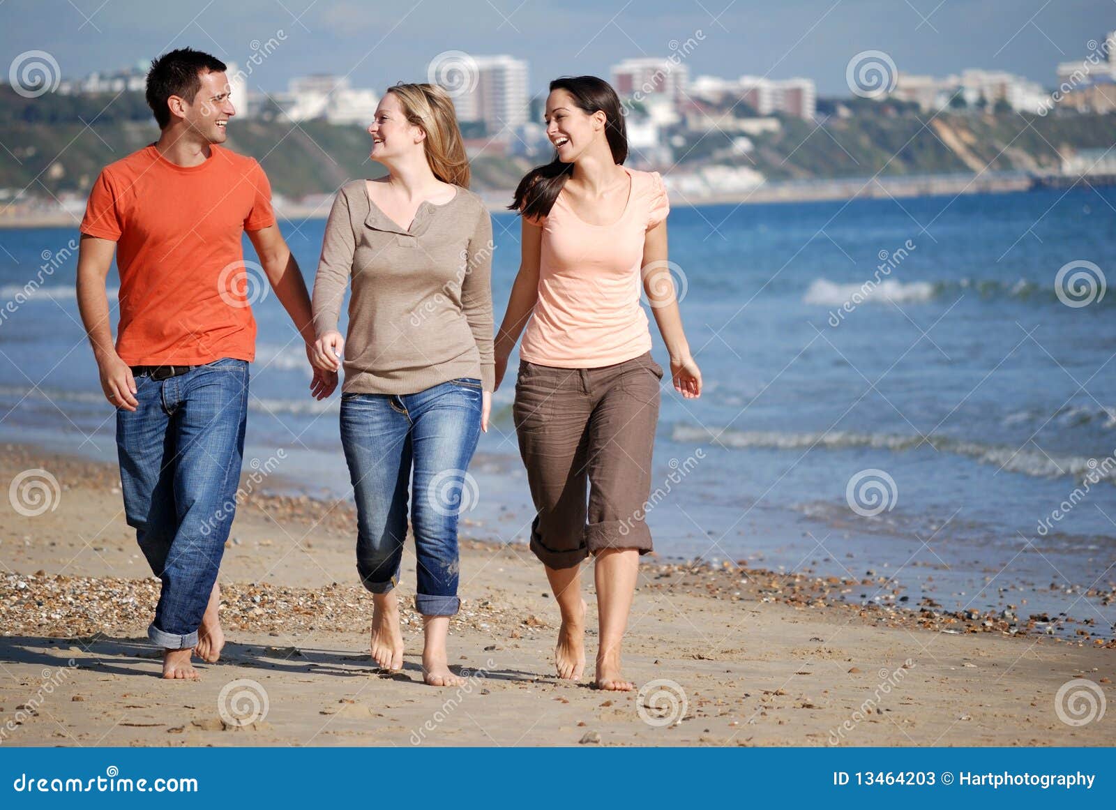 Friends Walking Along Beach Stock Image - Image of adults, strolling ...