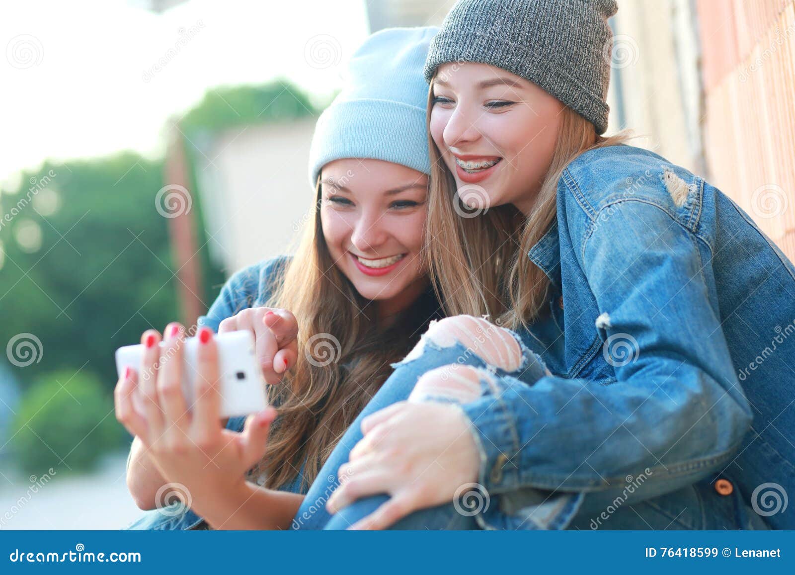 Friends watching videos stock image. Image of euphoric - 76418599