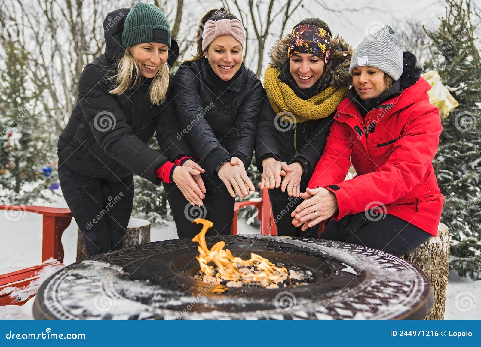 Friends in Winter Coats Sitting Fire in Forest Stock Photo - Image of ...