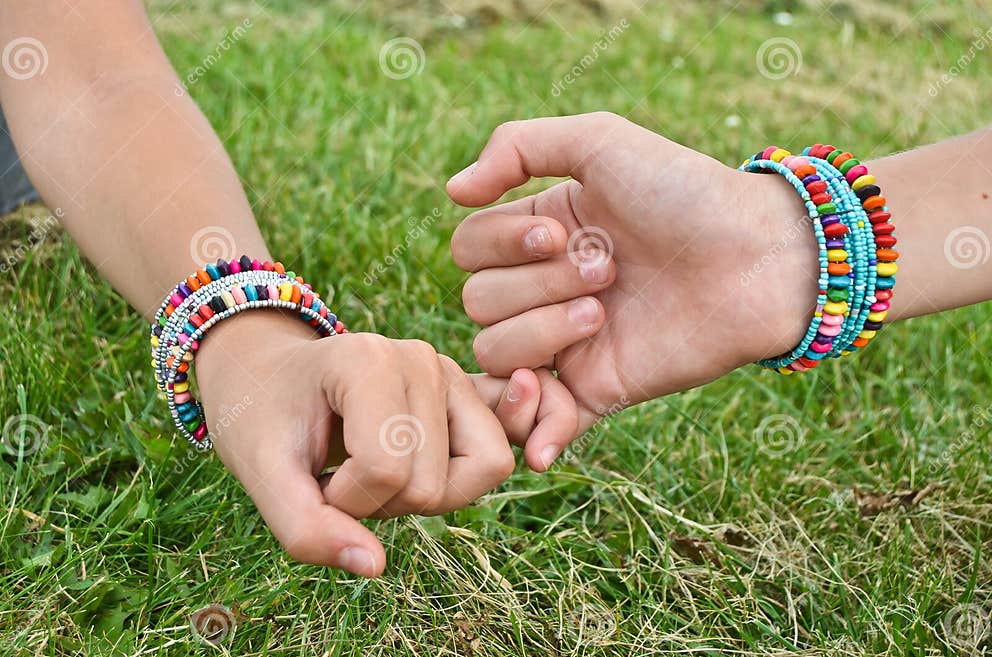 Friendship bracelets stock photo. Image of hands, women - 26429250