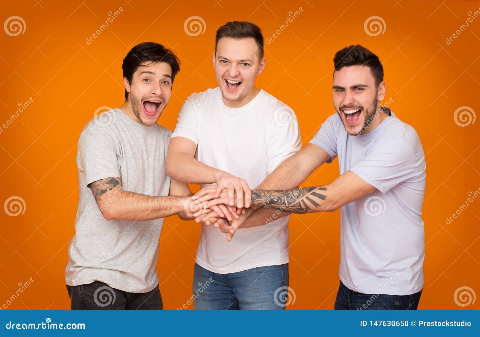 Friendship Forever. Three Men Joining Hands Together Stock Photo ...