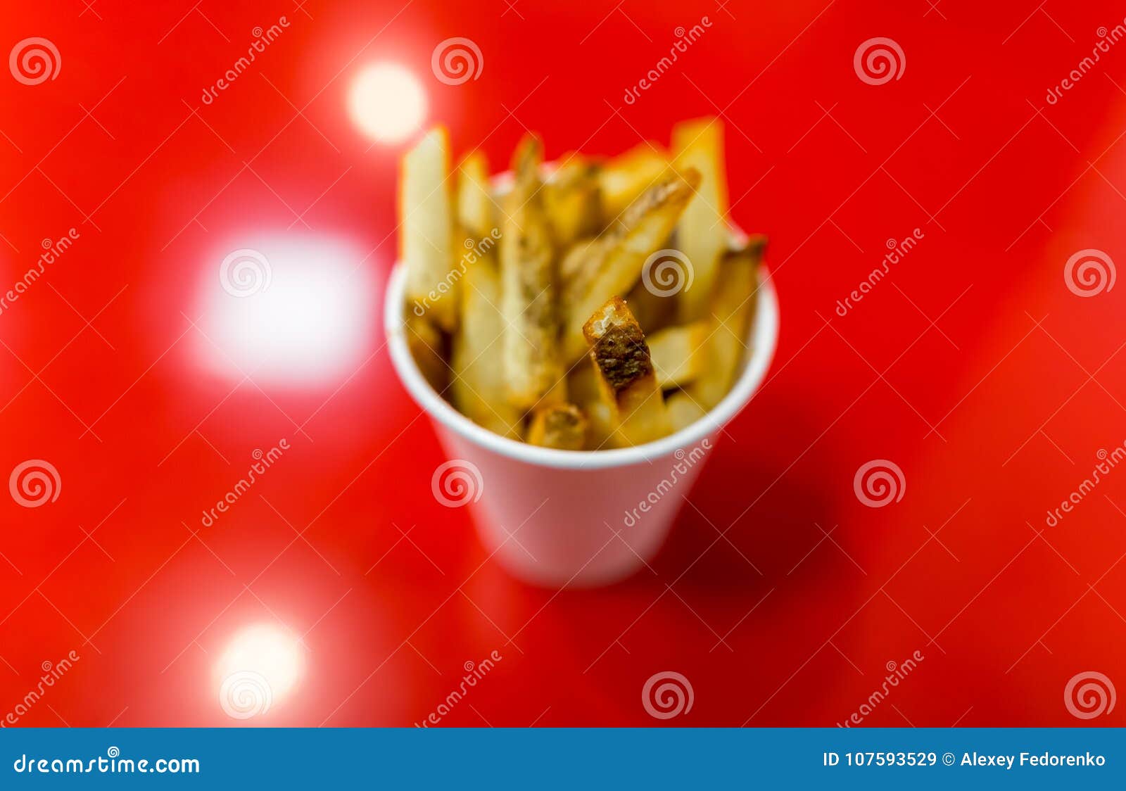 Fries in red restaurant stock image. Image of dining - 107593529
