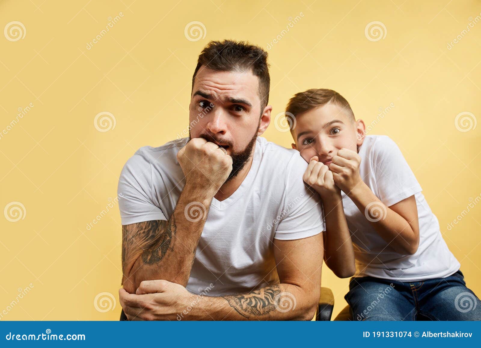 Frighetened Boy and Father Bite Nails and Look Camera on Yellow ...