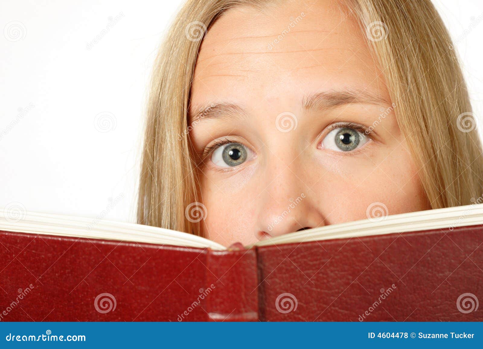 Frightened Girl Looking Over Book Stock Photo - Image of face, literacy ...