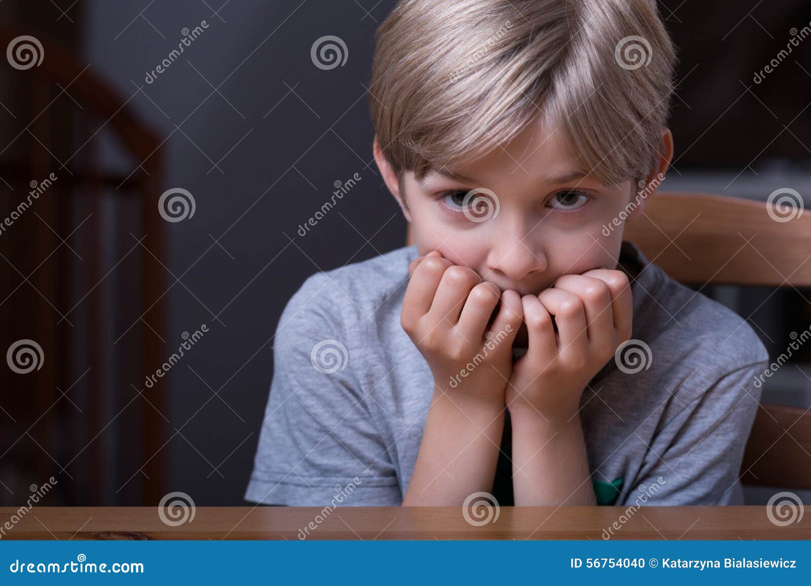 Frightened Kid Sitting at Table Stock Photo - Image of displeased ...
