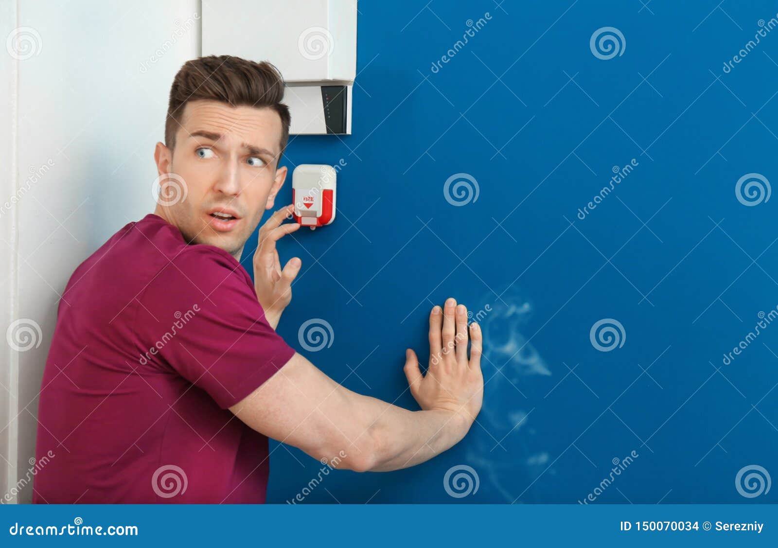 Frightened Man Using Fire Alarm System Indoors Stock Photo - Image of ...