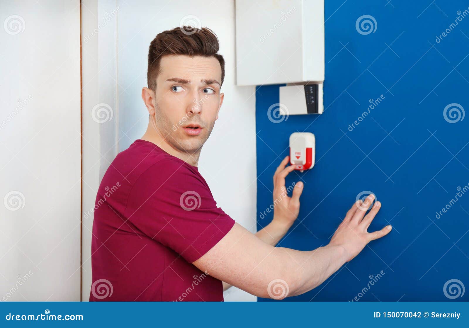 Frightened Man Using Fire Alarm System Indoors Stock Photo - Image of ...