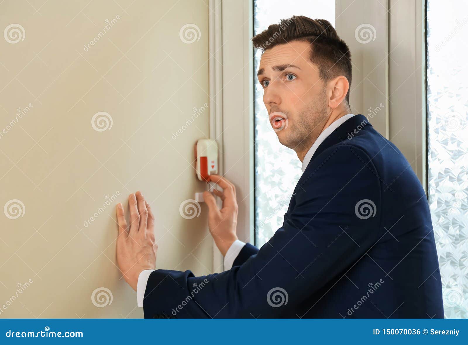 Frightened Man Using Fire Alarm System Indoors Stock Photo - Image of ...