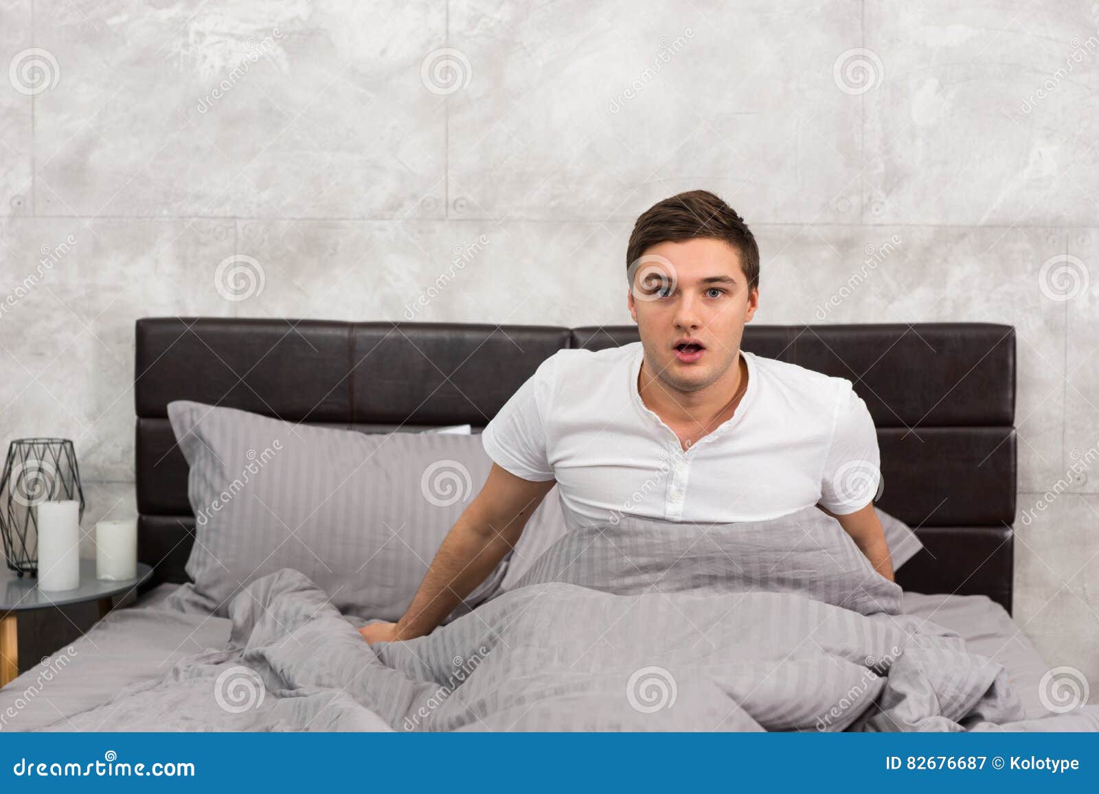 Frightened Man Woke Up from a Nightmare, Sitting in Bed Stock Image ... Frightened Man Woke Up from a Nightmare, Sitting in Bed Stock Image ...