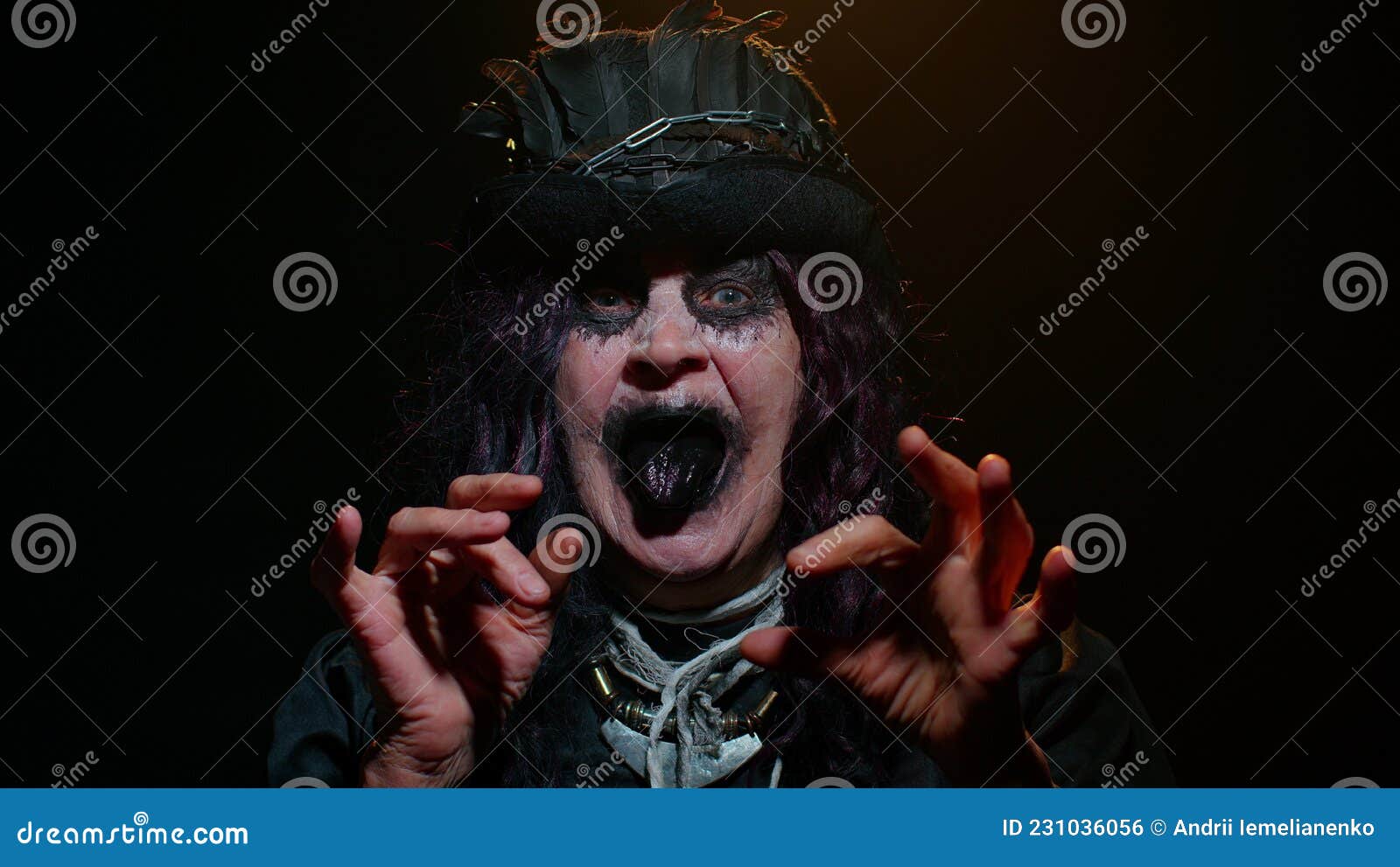 Frightening Senior Woman With Halloween Witch Makeup Trying To Scare