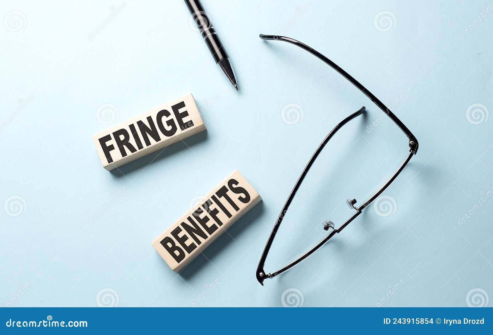 FRINGE BENEFITS Text on the Wooden Block ,blue Background Stock Photo ...
