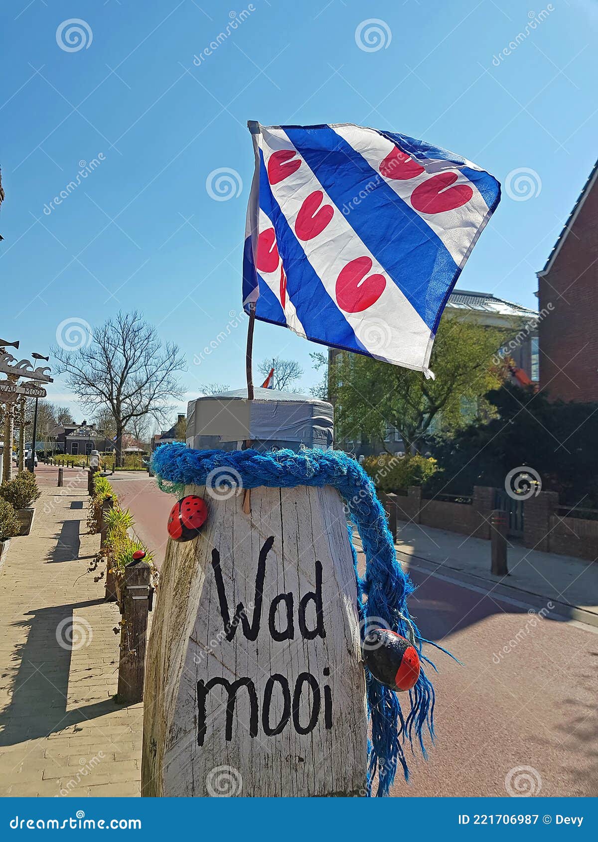 The Frisian Flag on a Pole with the Words `Wad Mooi Stock Image - Image ...