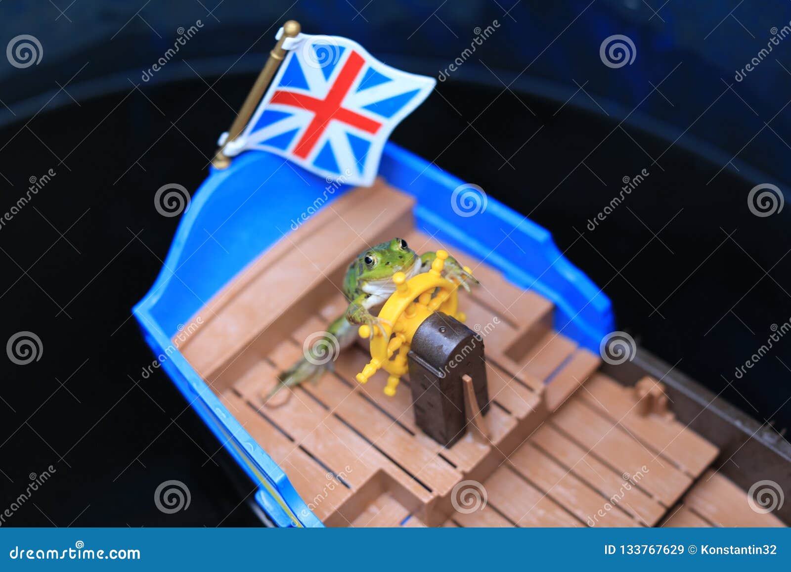 Frog at ship with UK flag stock image. Image of frog - 133767629