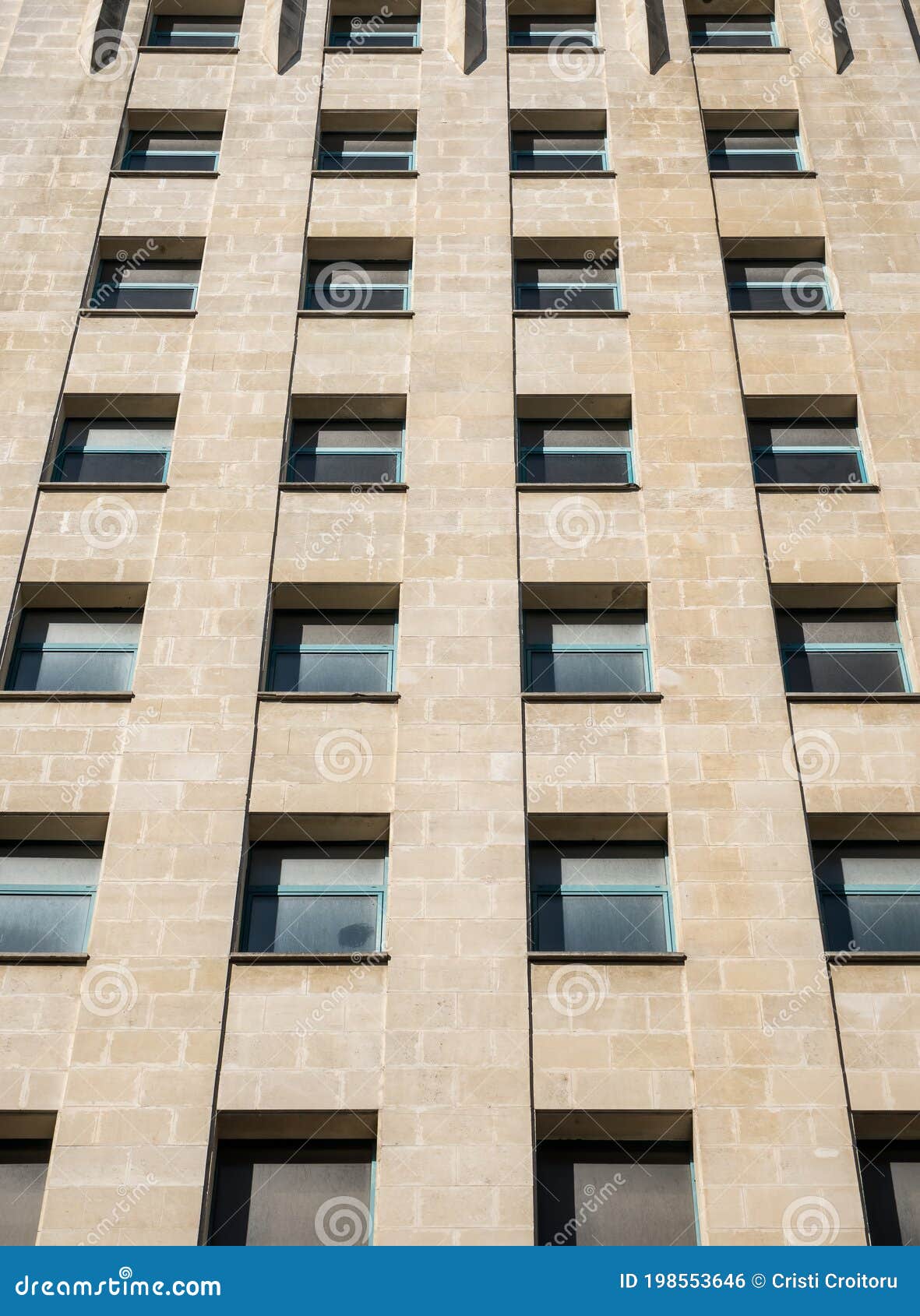 Front of a Building with Many Small Windows Stock Photo - Image of ...