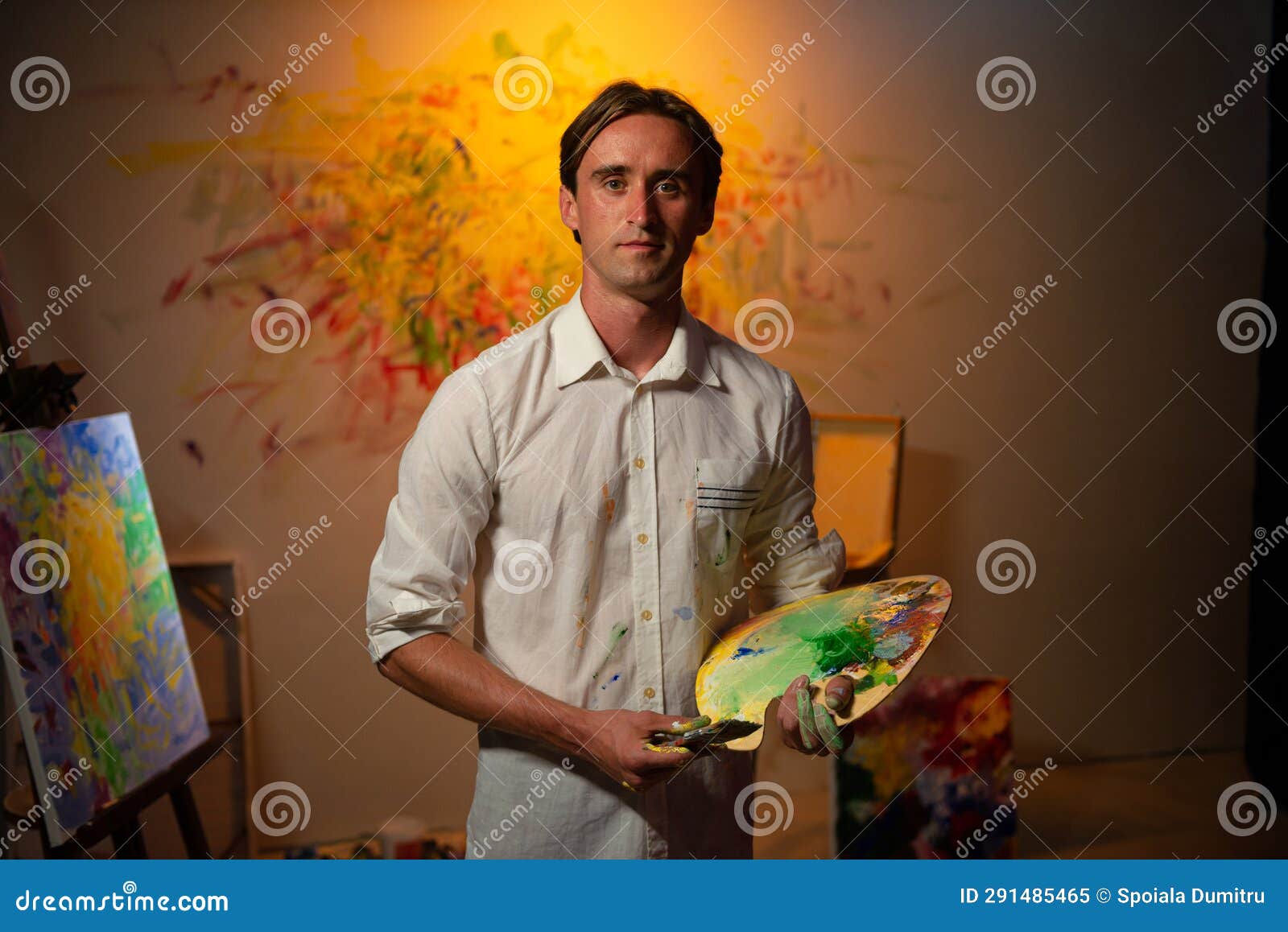 In Front of the Camera in Art Studio the Artist Guy Very Handsome ...