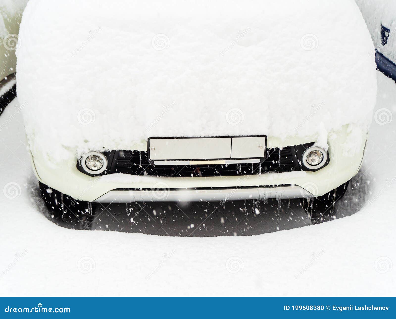 The Front of the Car of a Snow-covered Car Standing in a Snowdrift with ...