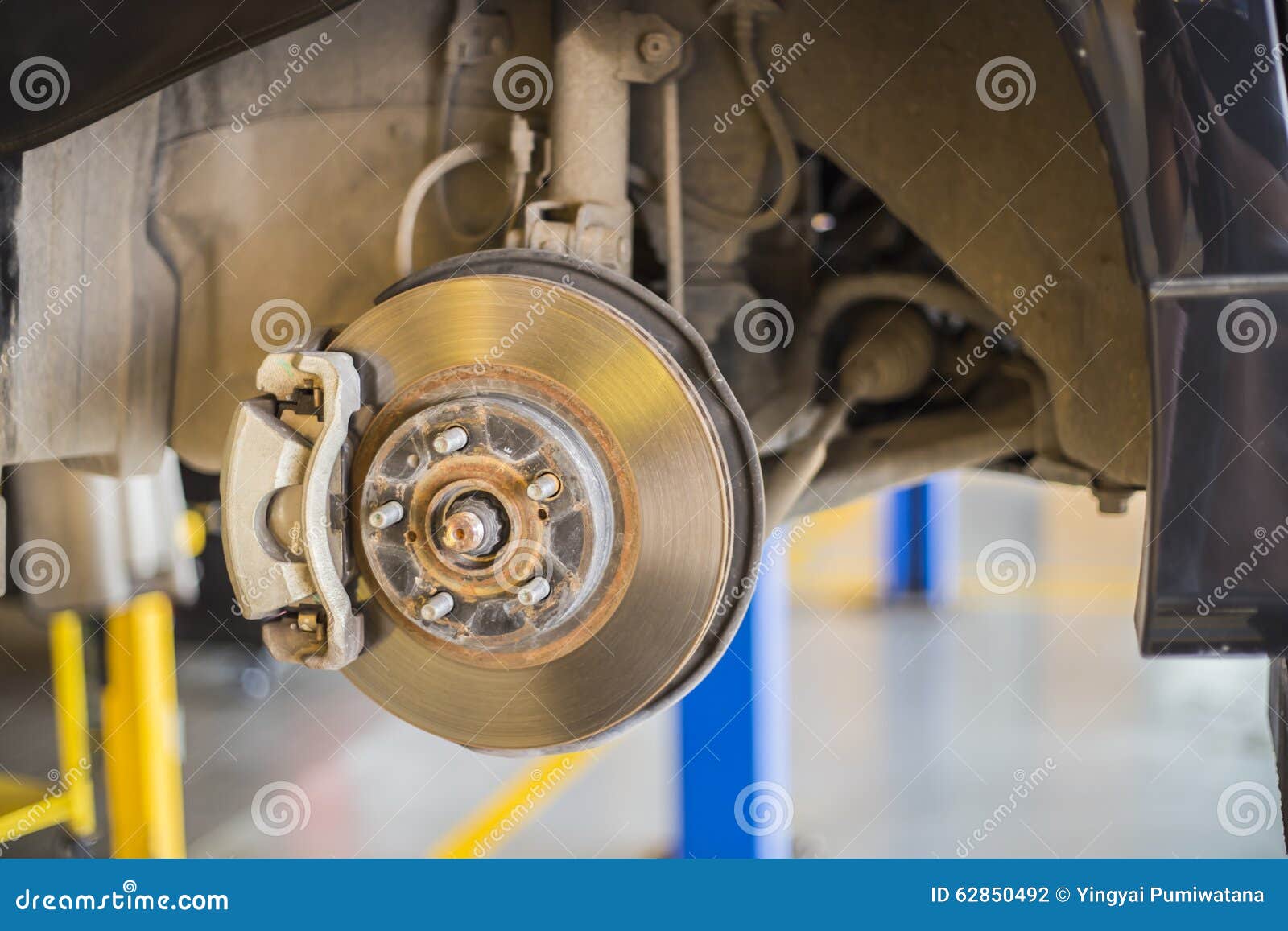 Front Disk Brake on Car in Process of Damaged Tyre Replacement Stock ...