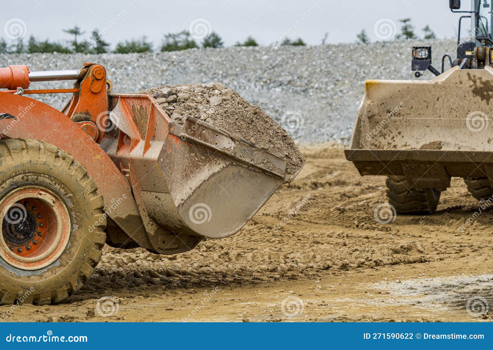 Front End Loader Dumping Stone and Sand in a Stock Photo - Image of ...