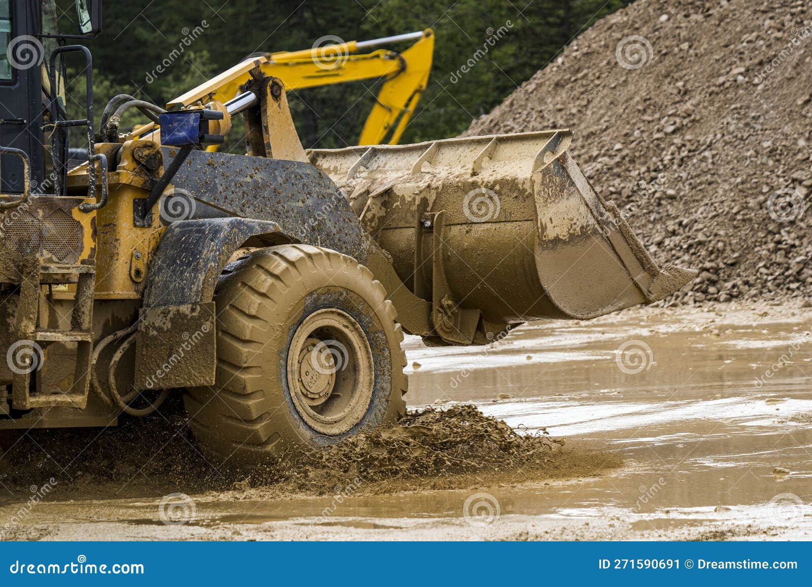 Front End Loader Dumping Stone and Sand in a Stock Image - Image of ...
