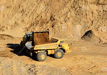 Front-end Loader Loading with Sand a Heavy Dump Truck Stock Photo ...