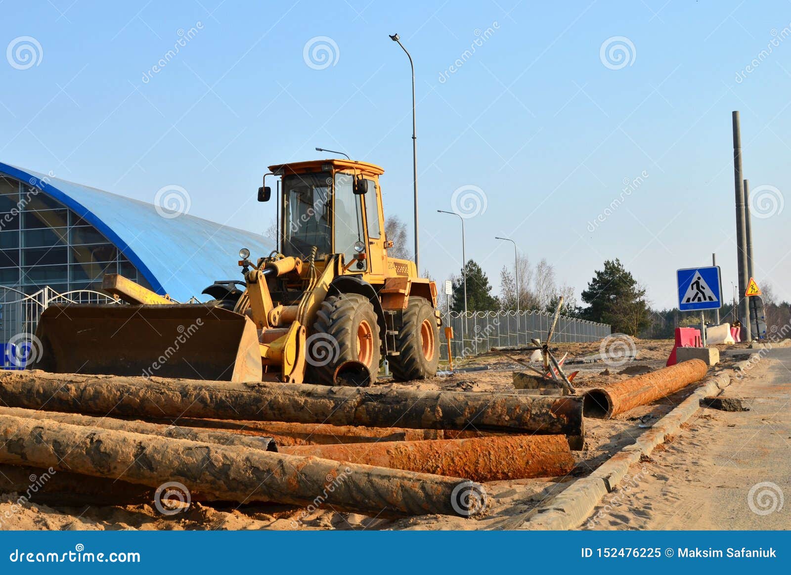 Front-end Loader Working on Construction Site during the Renovation of ...
