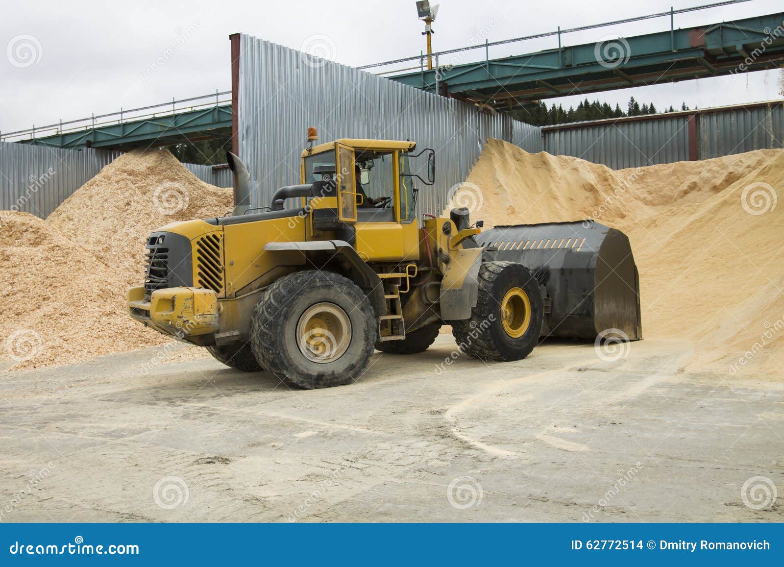 Front End Loader Working in Sawdust Storage Area Stock Photo - Image of ...